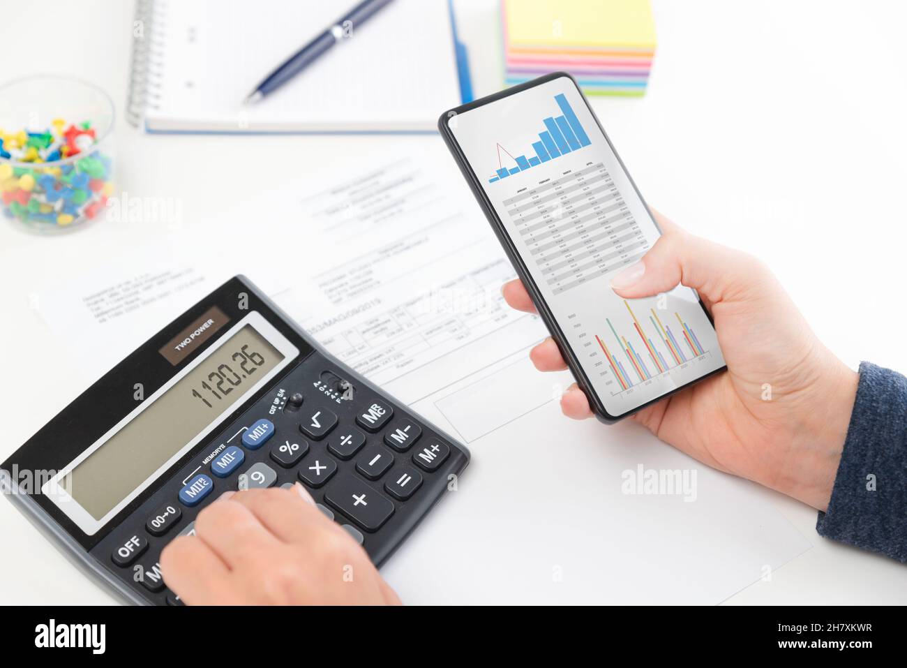 Budget, finance, business chart on smart phone screen Stock Photo - Alamy