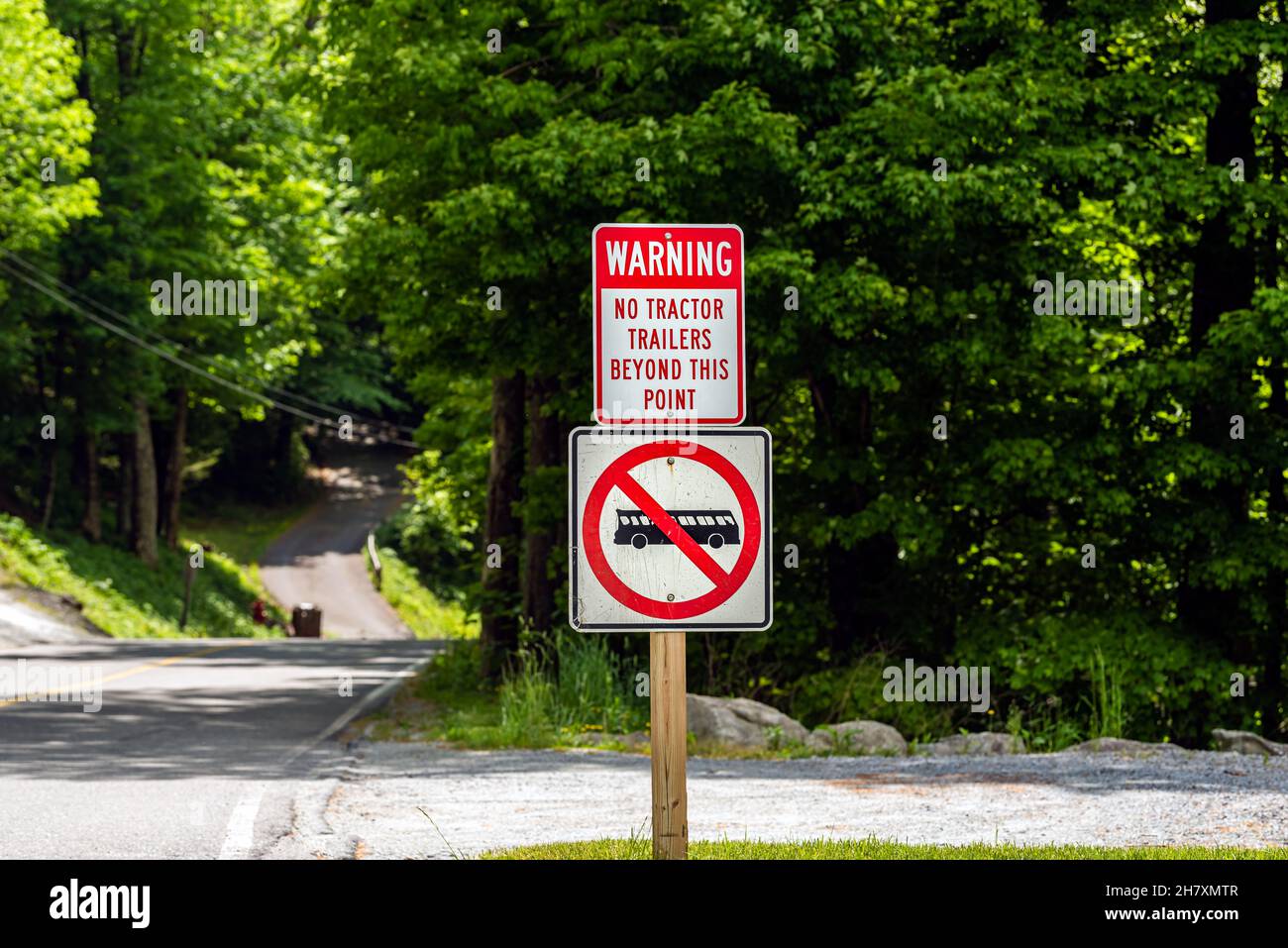 Closeup of warning traffic road sign for no tractor trailers beyond ...