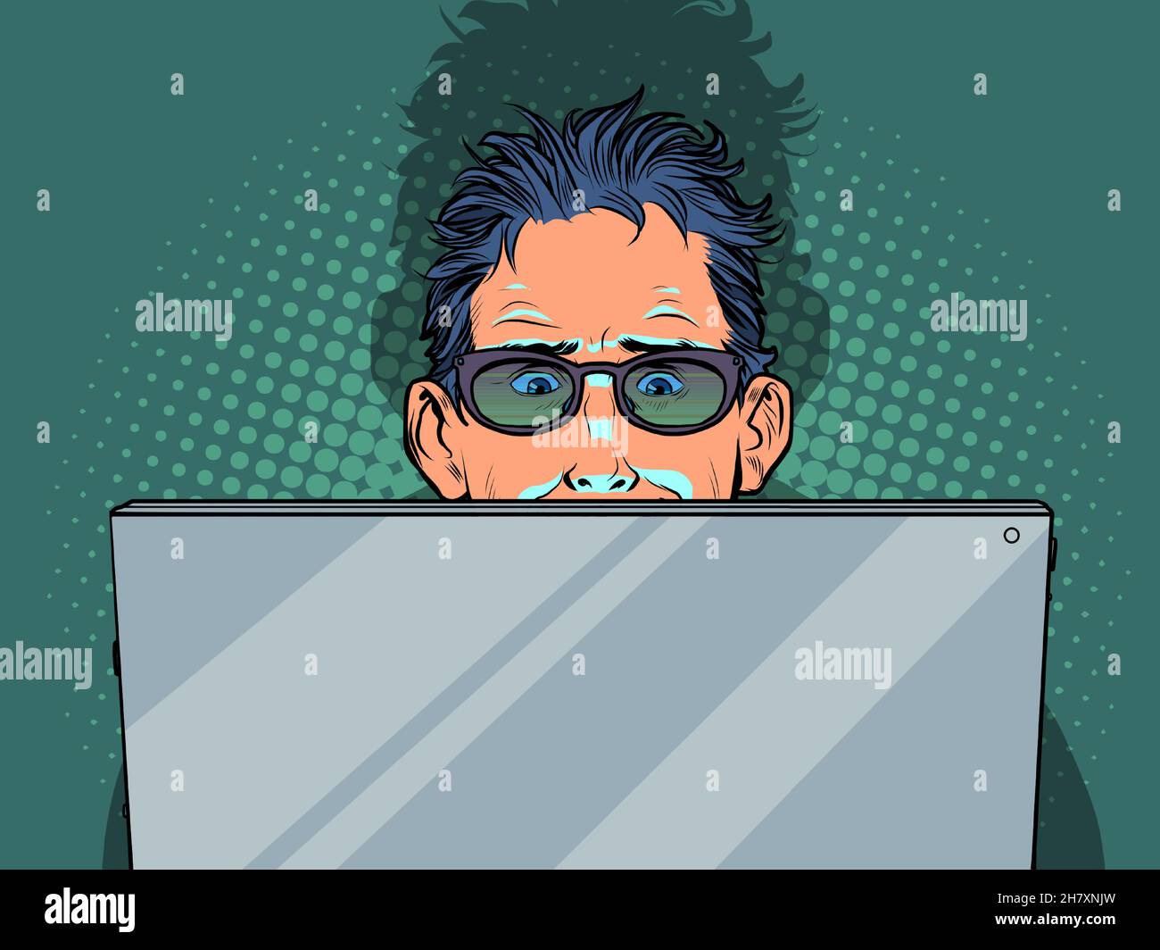 A man is looking at a laptop, the screen illuminates his face Stock ...