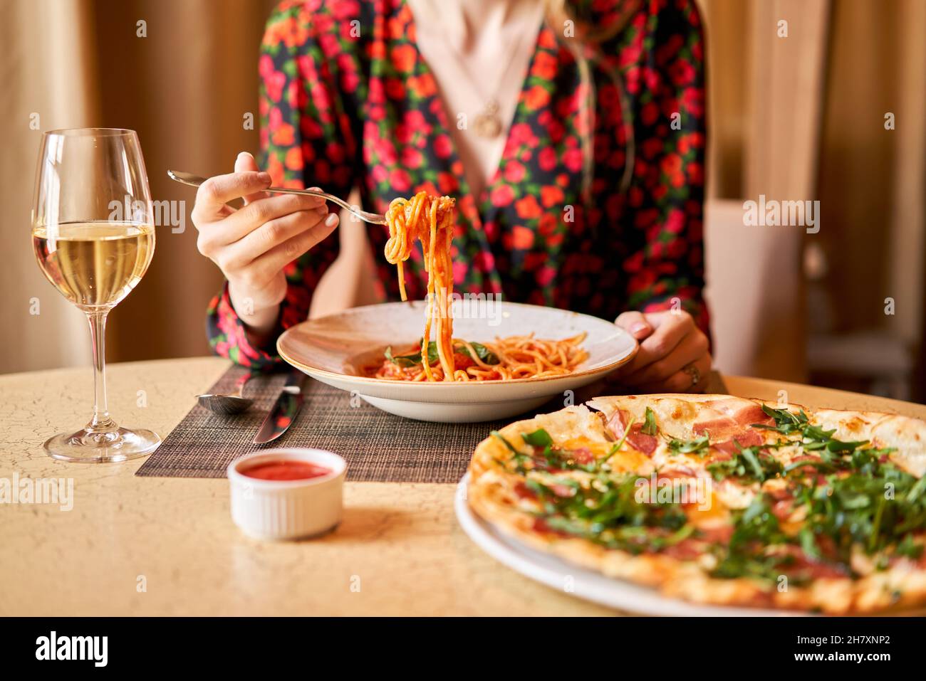 Woman eats Italian pasta with tomato, meat. Close-up spaghetti ...