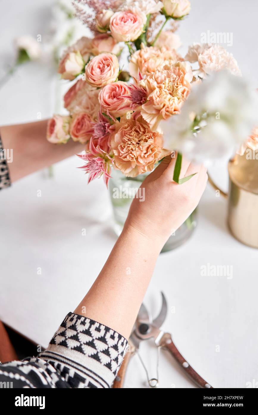 Step by step installation of flowers in a vase. Flowers bunch, set for ...