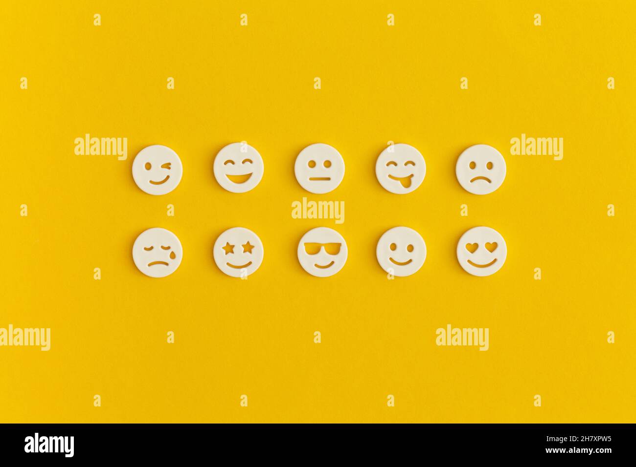 Emoticon smile on a yellow background. Customer feedback Stock Photo ...