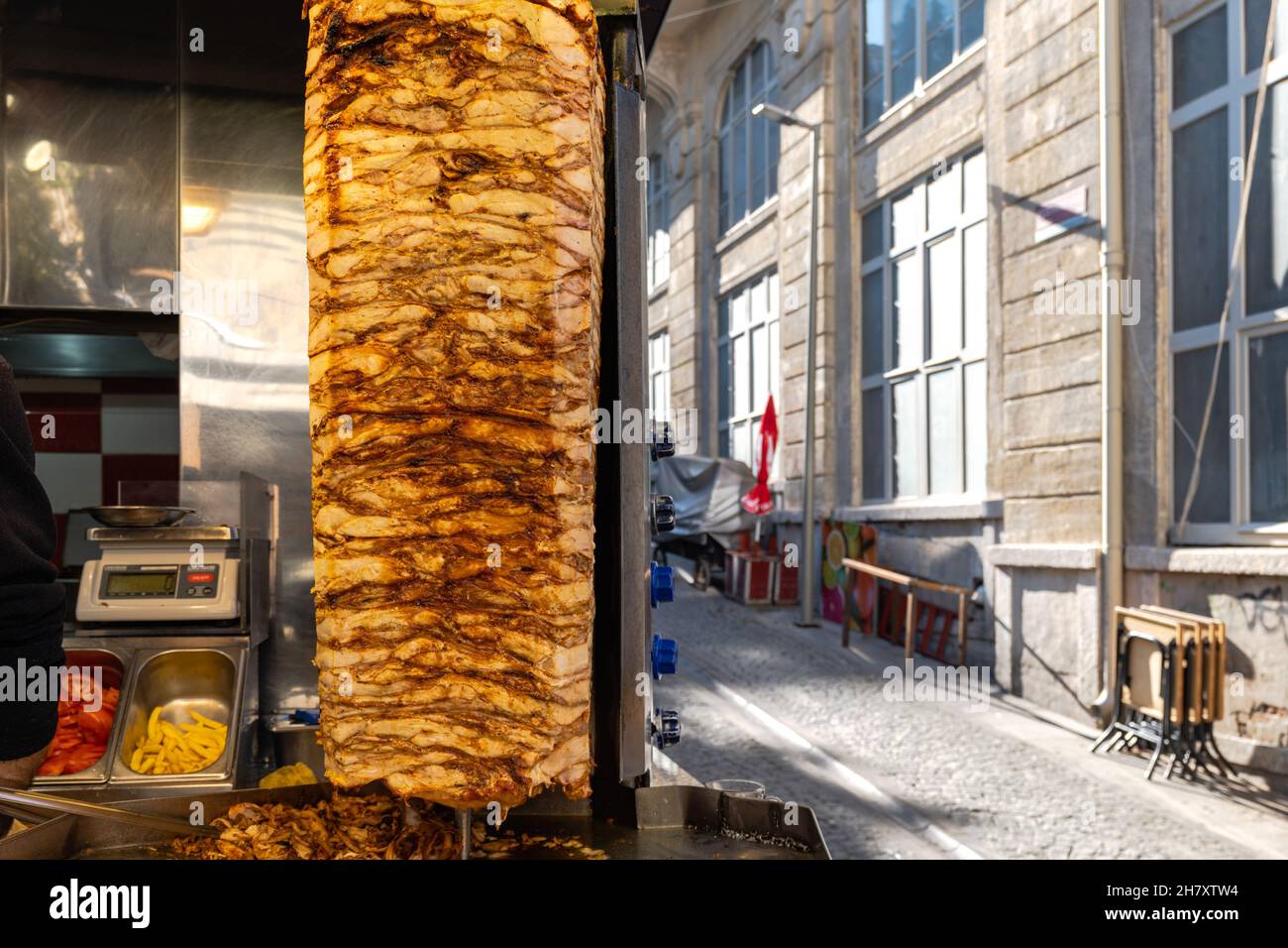 Kebab meat on rotary grill - Turkish doner chicken kebab stand in ...