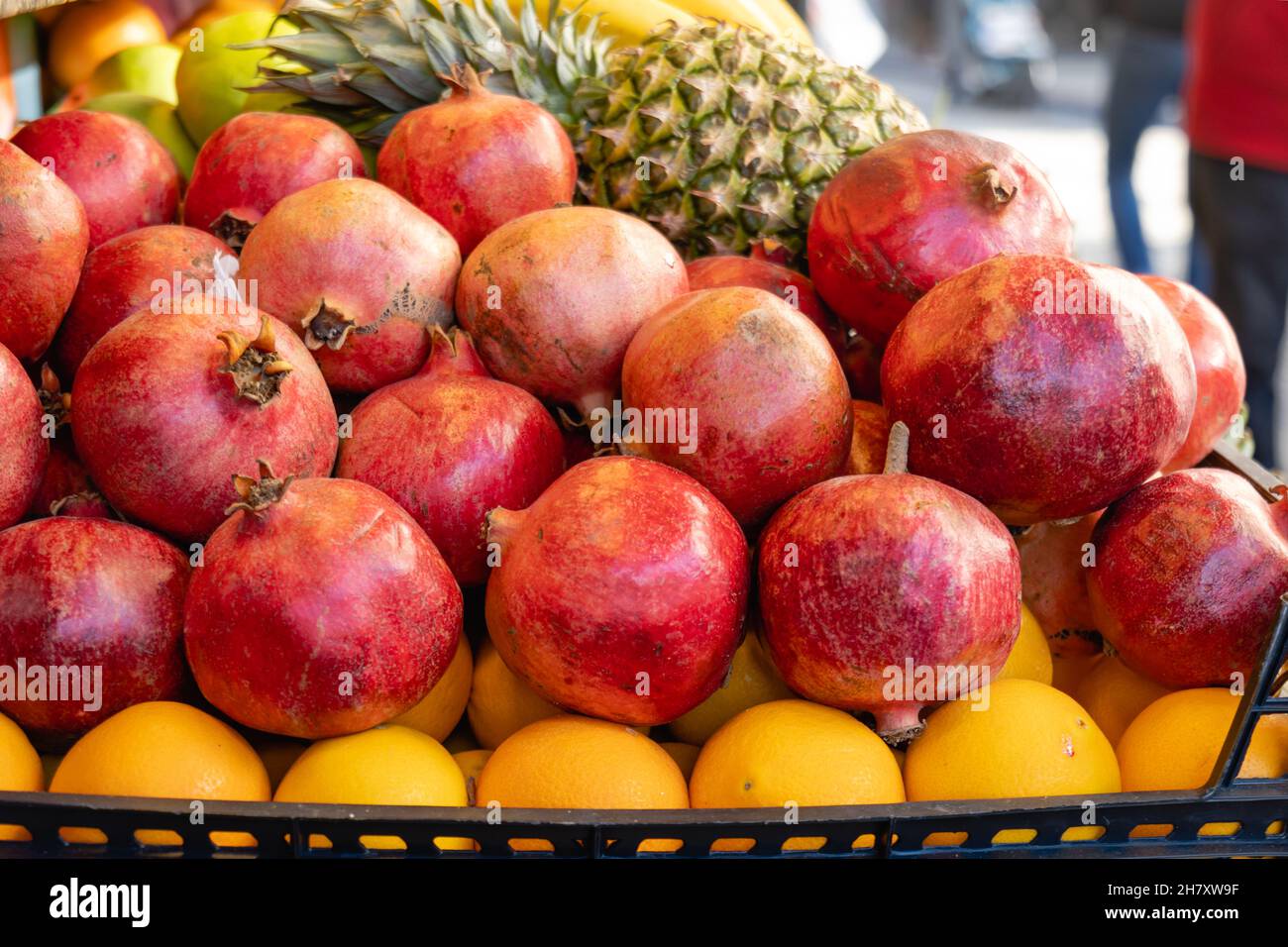 Pomegranate and tropical fruits, bananas, pineapples, lemons, citrus ...