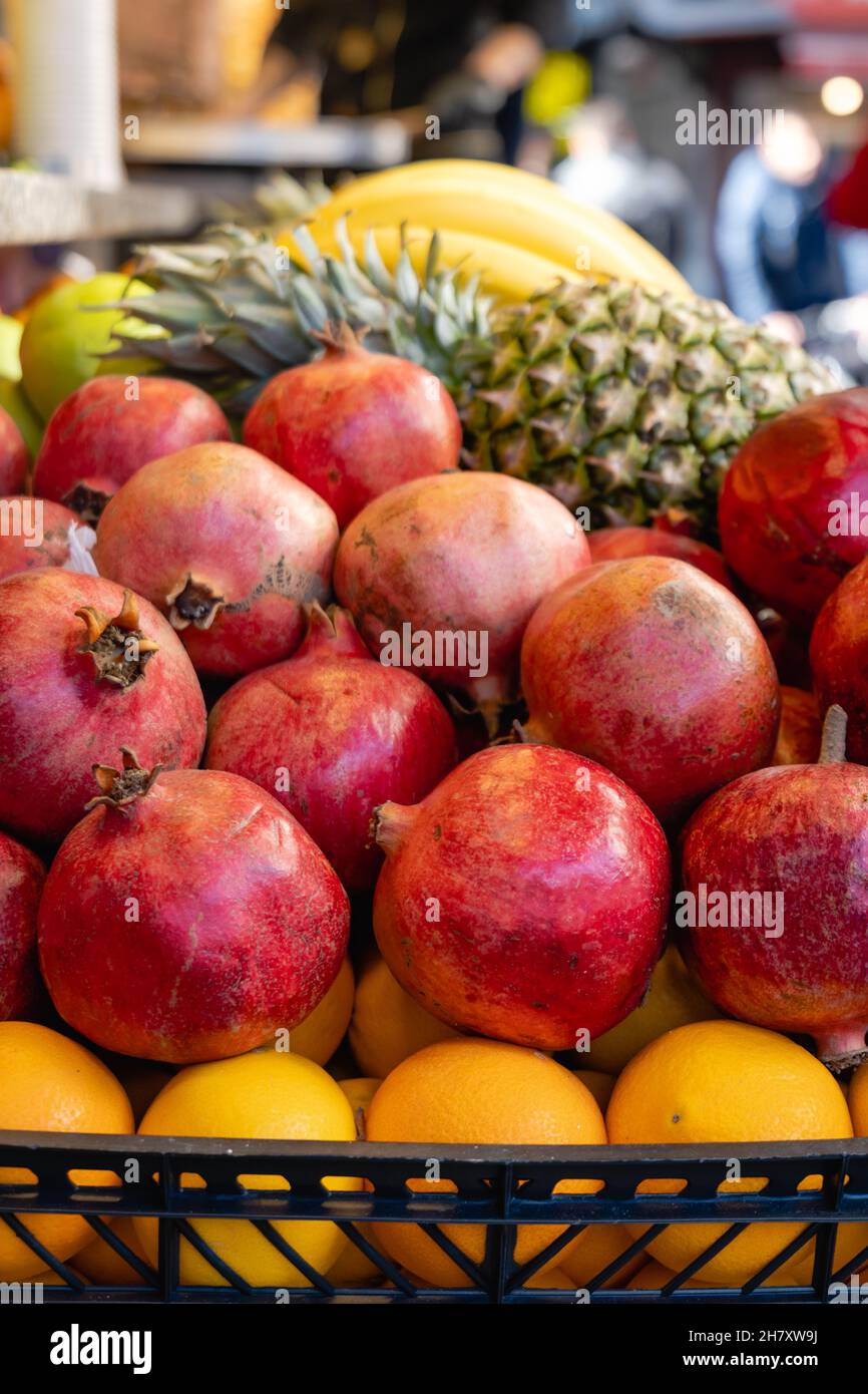 Pomegranate and tropical fruits, bananas, pineapples, lemons, citrus ...