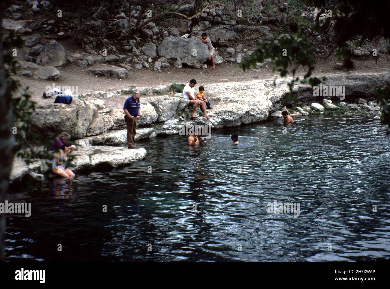 Uxmal Mexico. 12/27/1985. Laundry and bathing in a cenote Stock Photo ...
