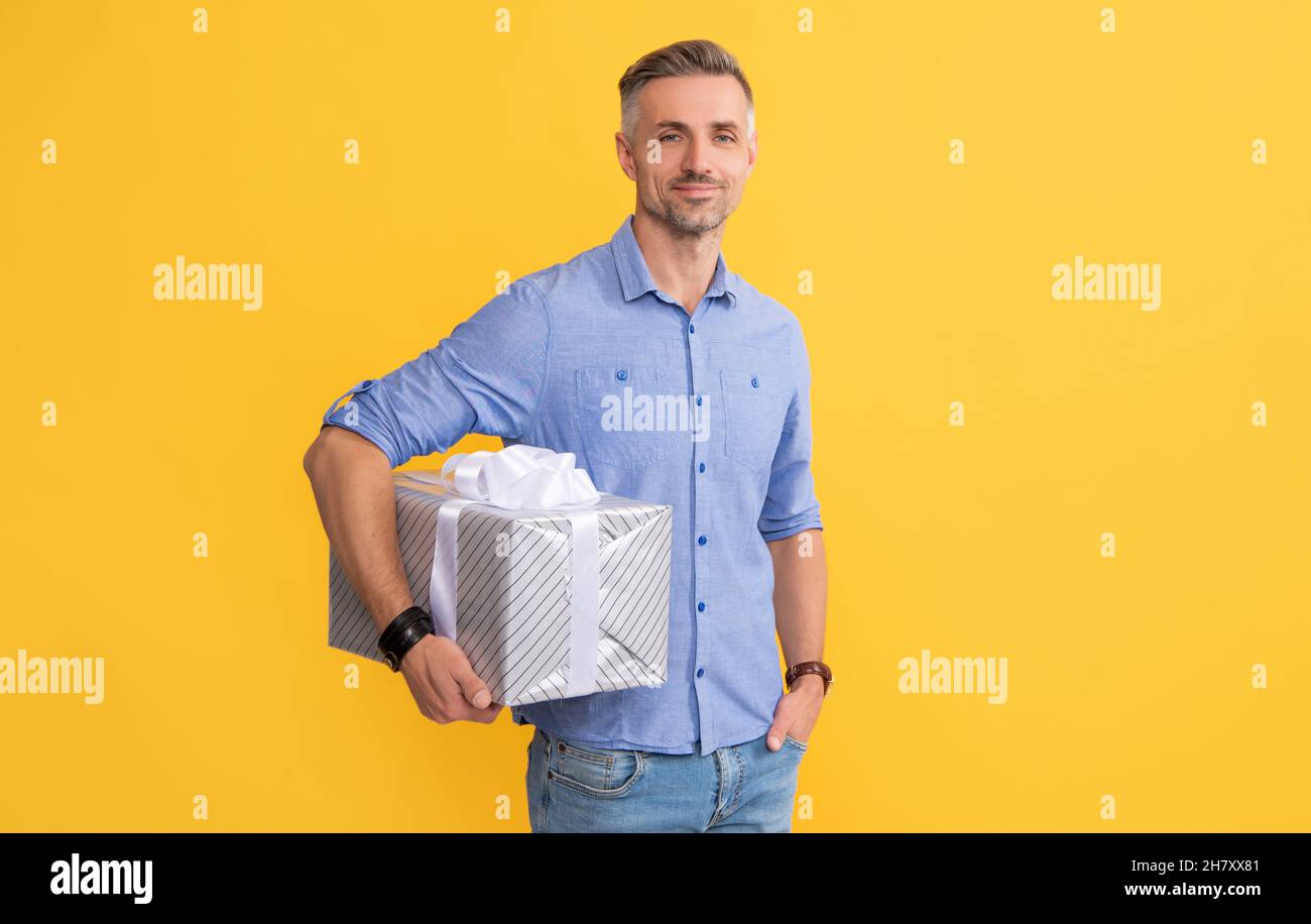 Smiling mature man present hi-res stock photography and images - Alamy