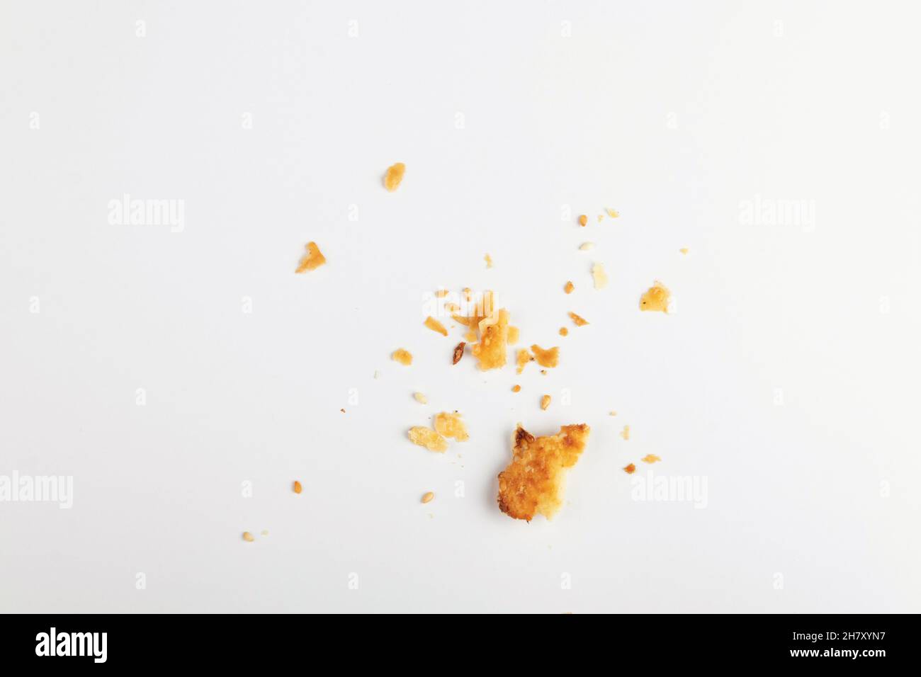 Scattered crumbs isolated on white background Stock Photo - Alamy