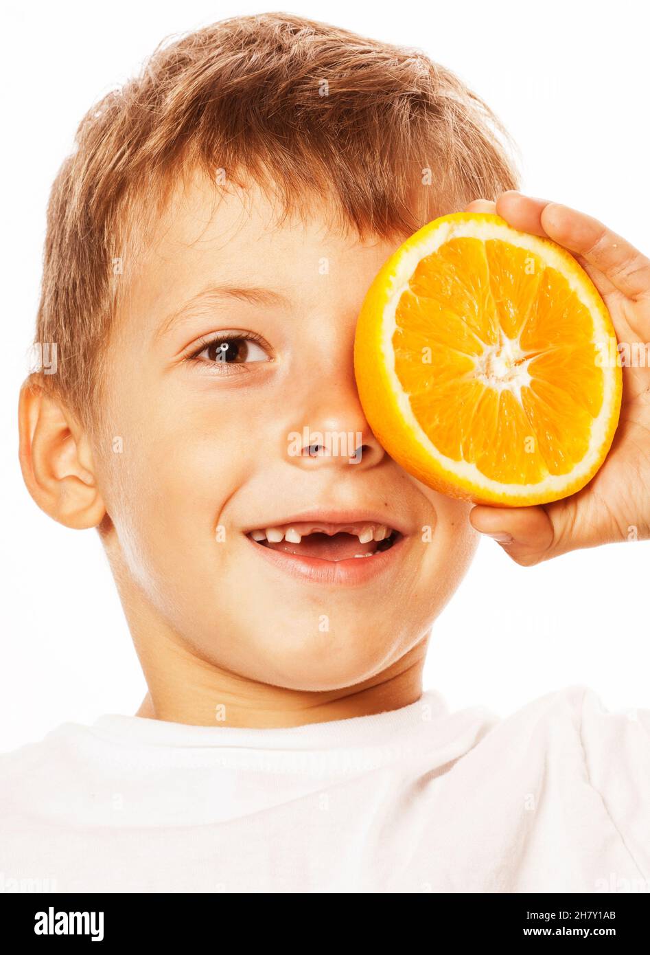 little cute boy with orange fruit double isolated on white smiling ...