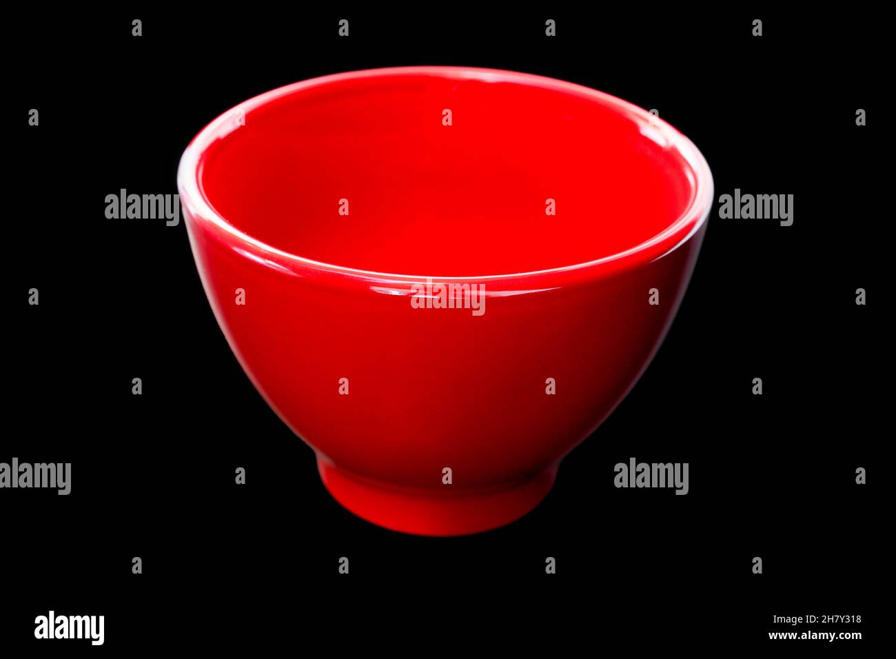 Red ceramic bowl isolated on black lackground. Empty dishware Stock ...