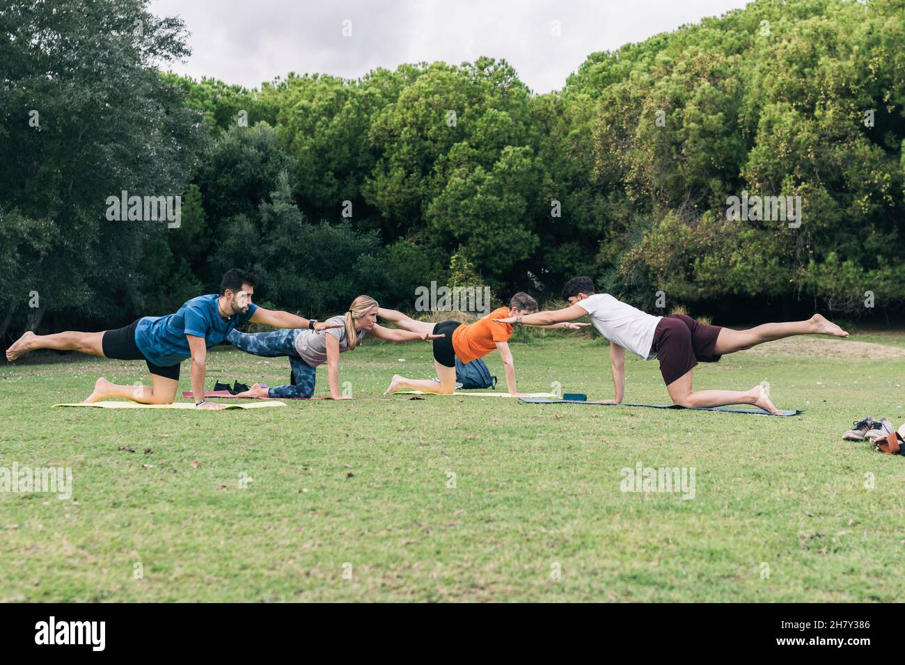 Group young people doing yoga hi-res stock photography and images - Alamy