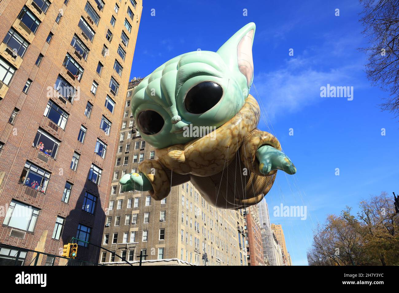 New York, N.Y/USA – 25th Nov. 2021: The Grogu balloon is led down ...