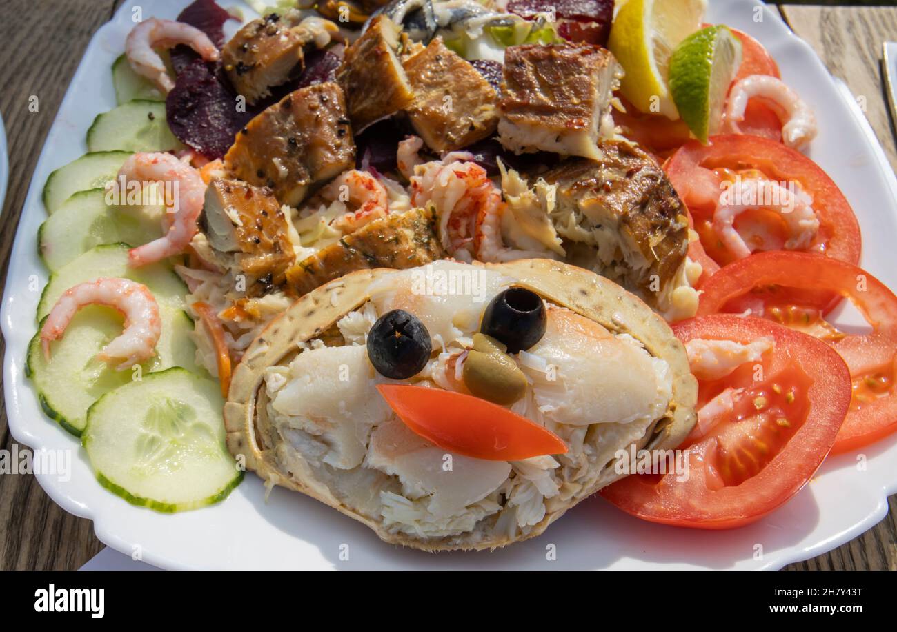 Typical mixed cold crab and seafood salad lunch with prawns, shellfish ...