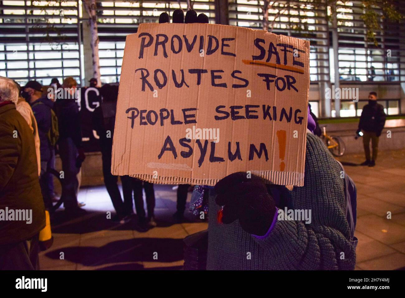 A protester holds a placard which says 'Provide Safe Routes For People ...