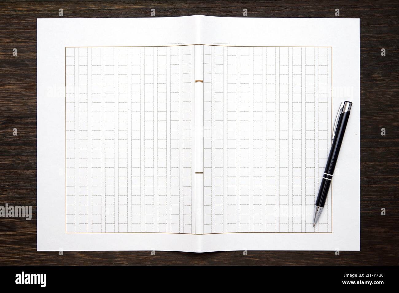 Japanese manuscript paper with ballpoint pen. Genko yoshi on wooden ...