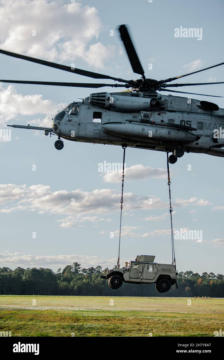 A Marine Corps CH-53 “Super Stallion” conducts a sling load training ...