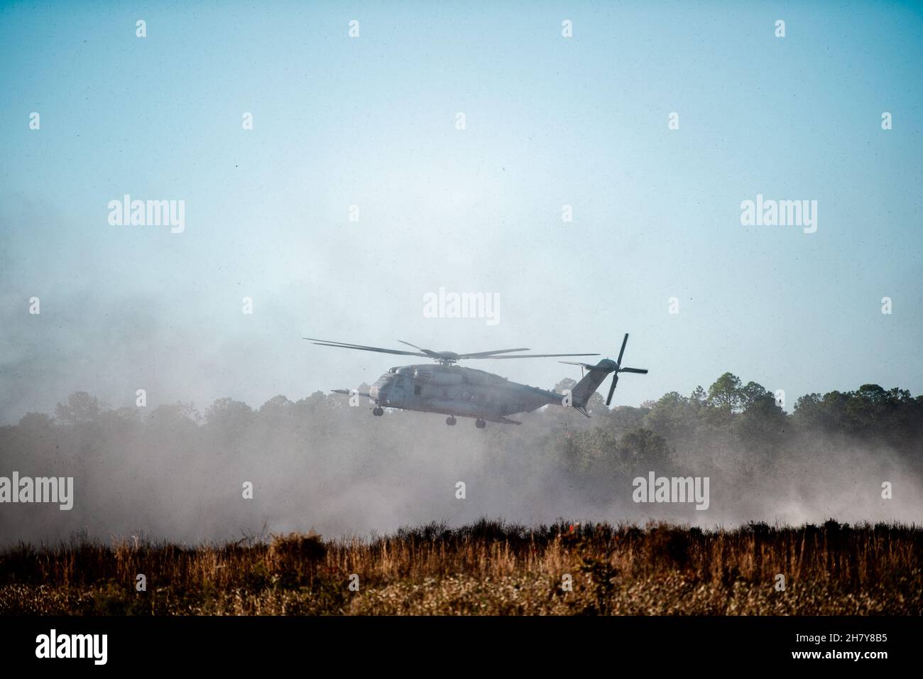 A Marine Corps CH-53 “Super Stallion” conducts a sling load training ...