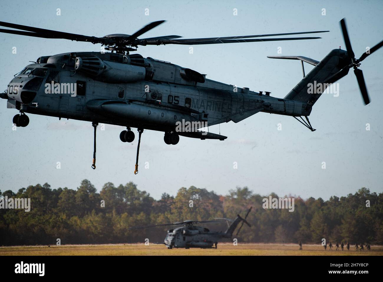 A Marine Corps CH-53 “Super Stallion” conducts a sling load training ...