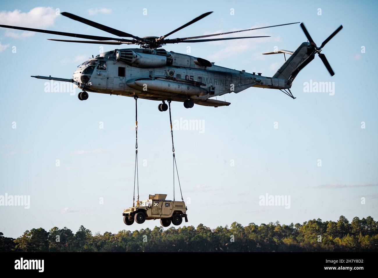 A Marine Corps CH-53 “Super Stallion” conducts a sling load training ...