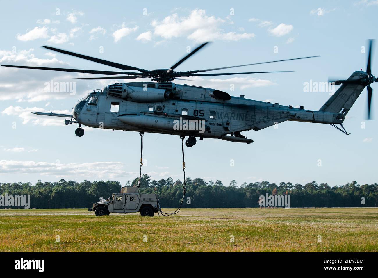 A Marine Corps CH-53 “Super Stallion” conducts a sling load training ...