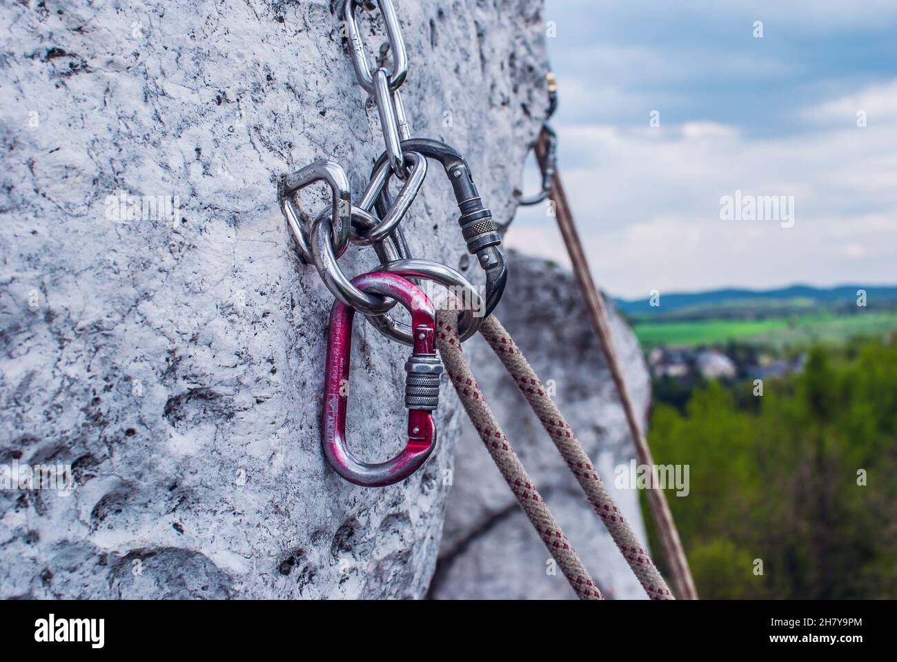 Climbing rope attached to the rock Stock Photo - Alamy