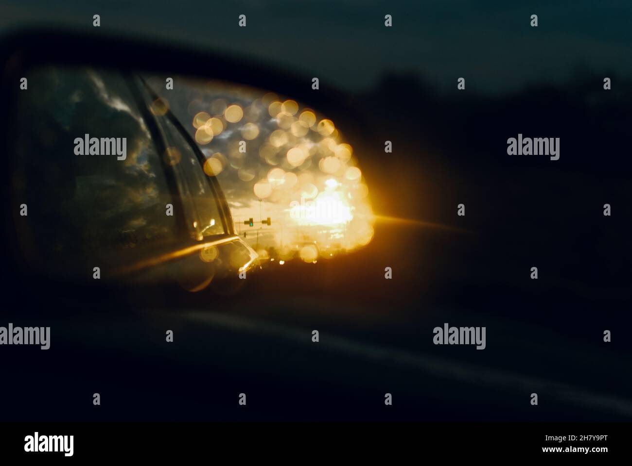 Sunlight in a car mirror Stock Photo - Alamy