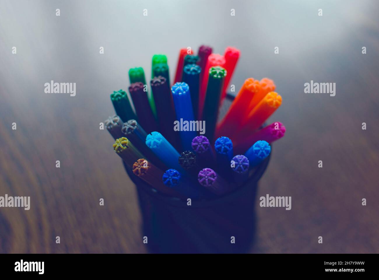 Colored markers in a container Stock Photo - Alamy