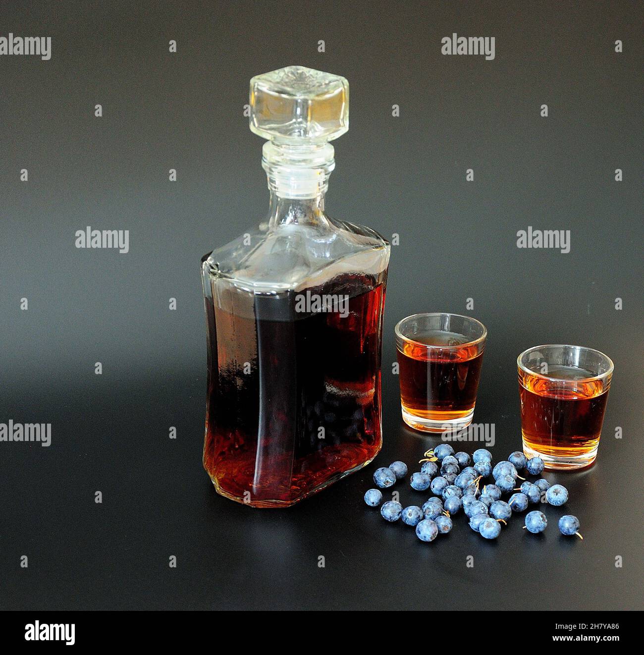 Homemade blueberry liqueur, a strong alcoholic drink in a glass ...