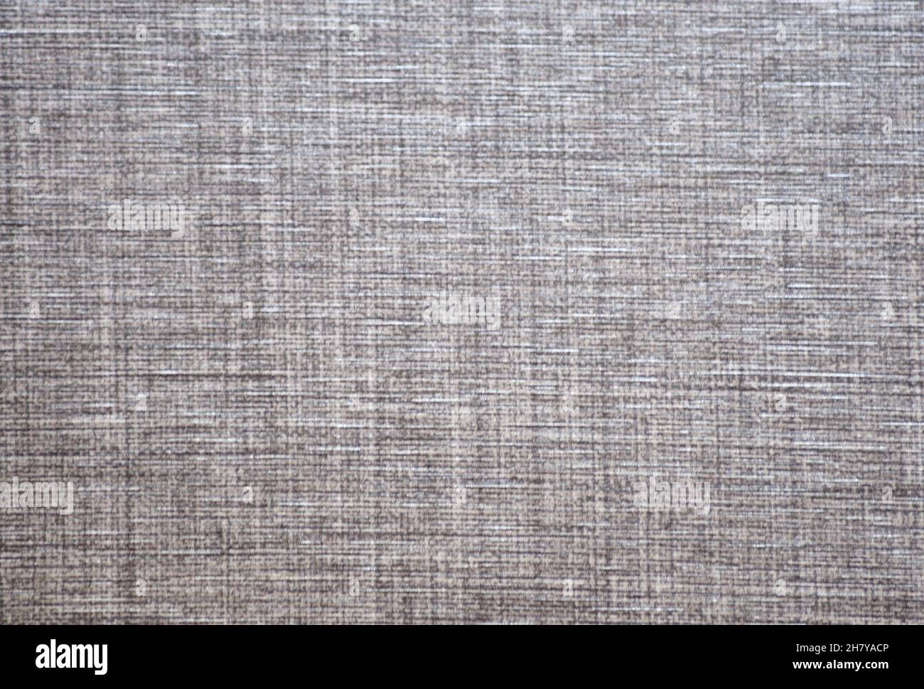 A fragment of natural gray fabric with a pattern of weaving in ...
