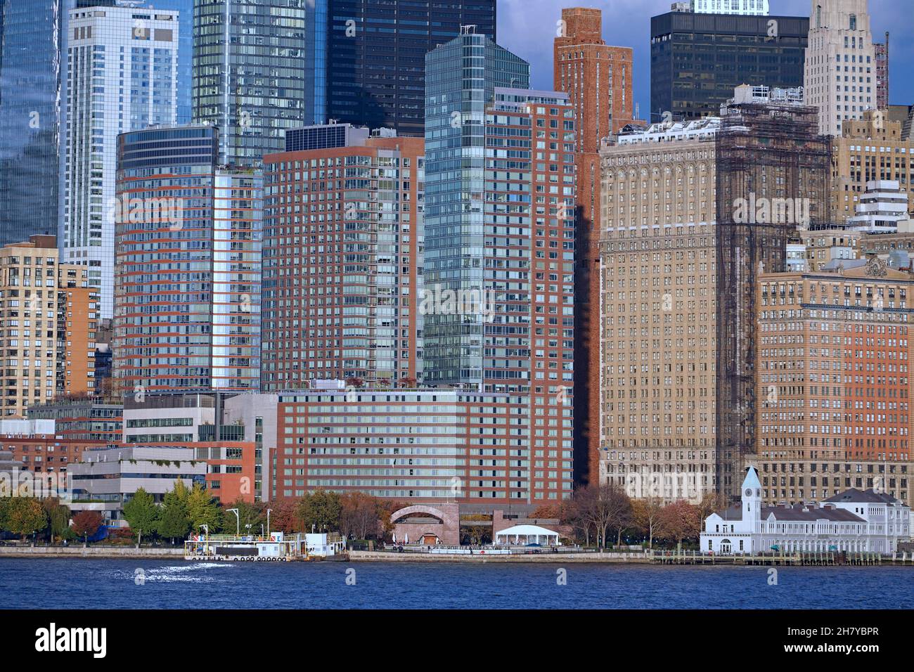 Colorful high rise buildings overlooking New York Harbor and Battery ...