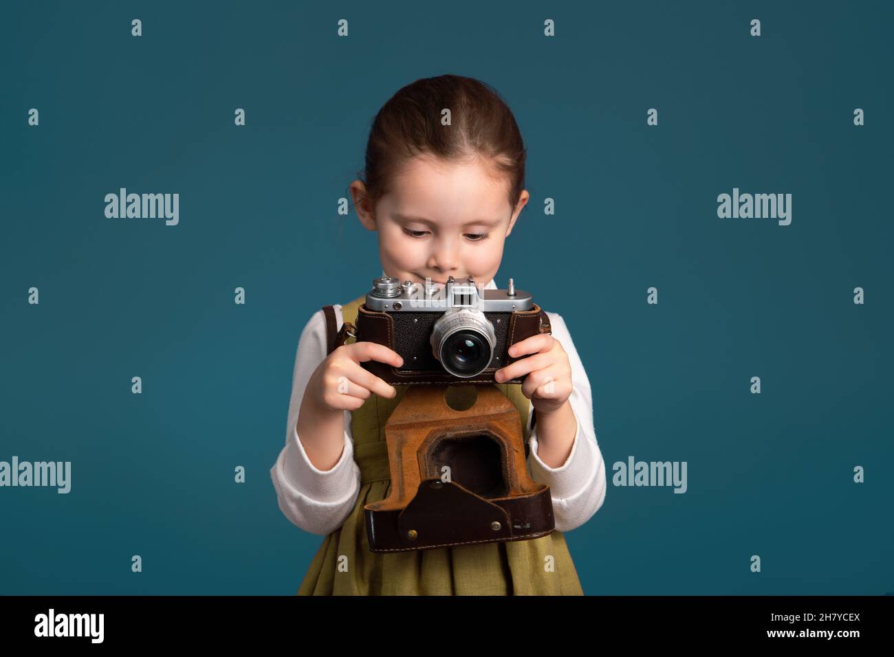Cute little girl happy with photography learning results Stock Photo ...