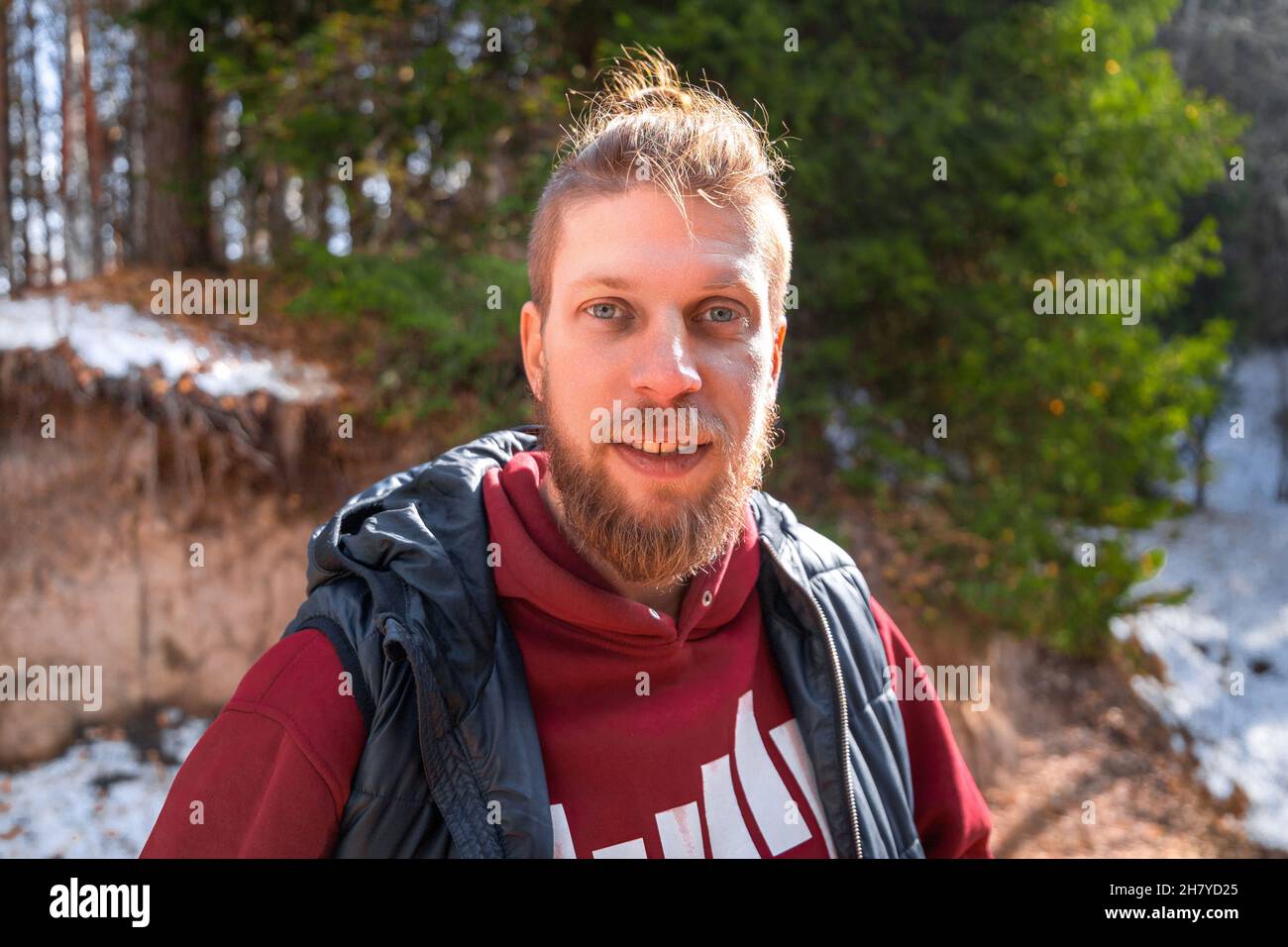 Outdoor portrait of blond hipster man in nature Stock Photo - Alamy