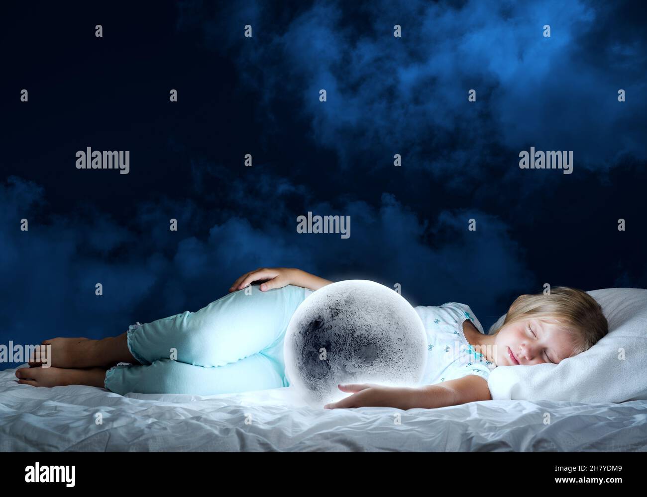 Girl in her bed and moon planet Stock Photo - Alamy