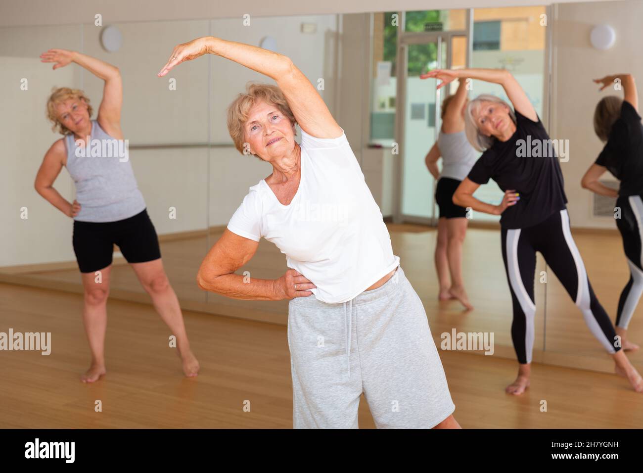 Mature women practice active dancing in the studio Stock Photo - Alamy