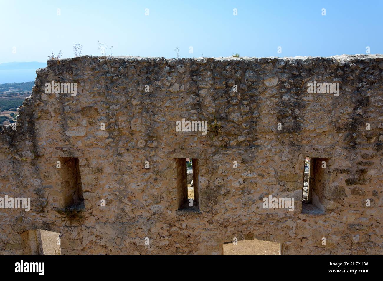 Walls of a building featuring windows inside the castle of Saint George ...