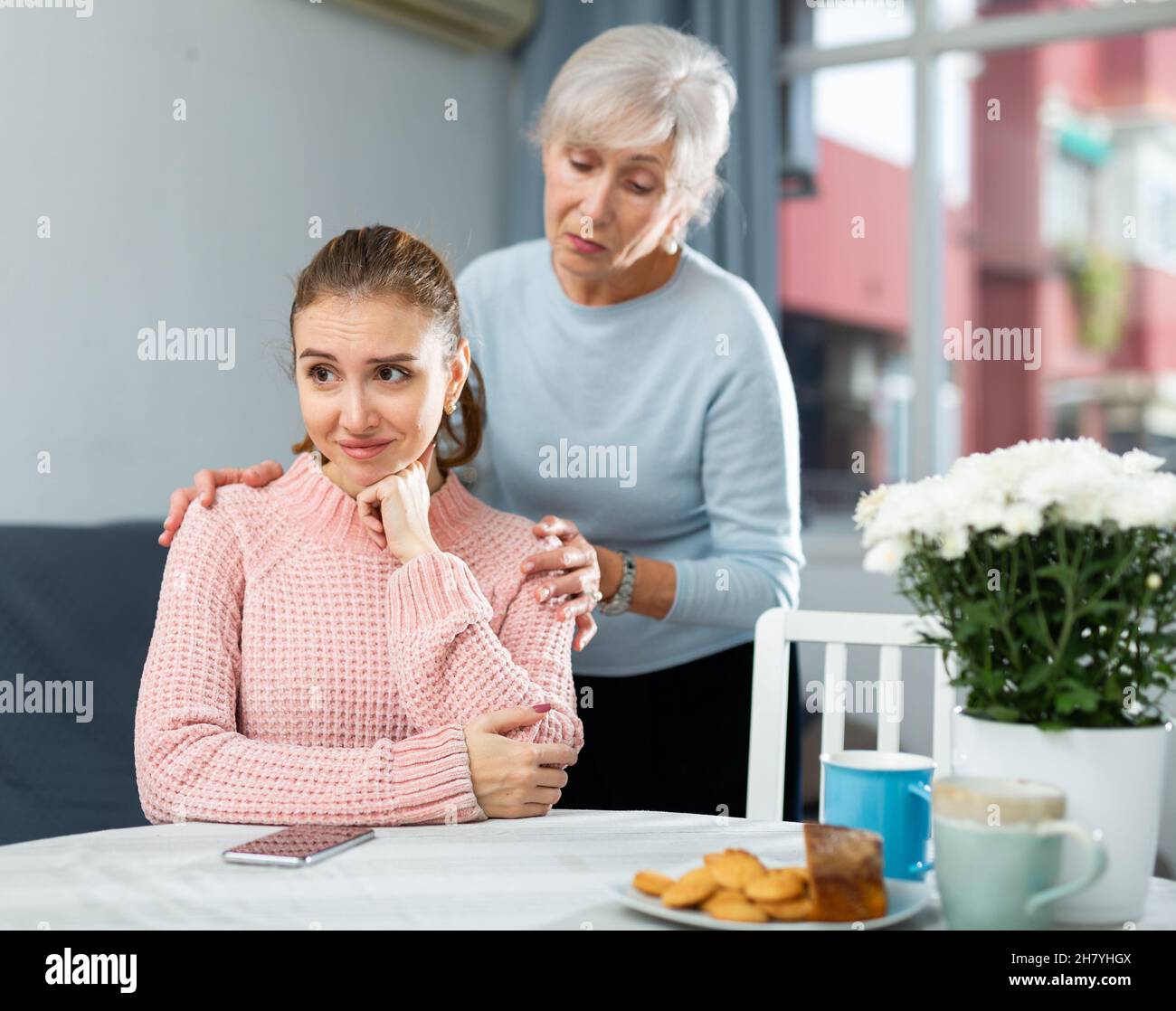 Sad woman and her mother Stock Photo - Alamy