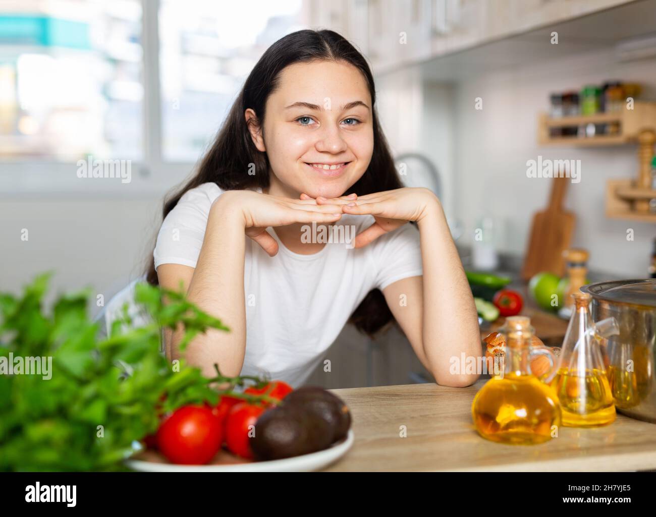 Portrait of woman posing with healthy food at kitchen Stock Photo - Alamy