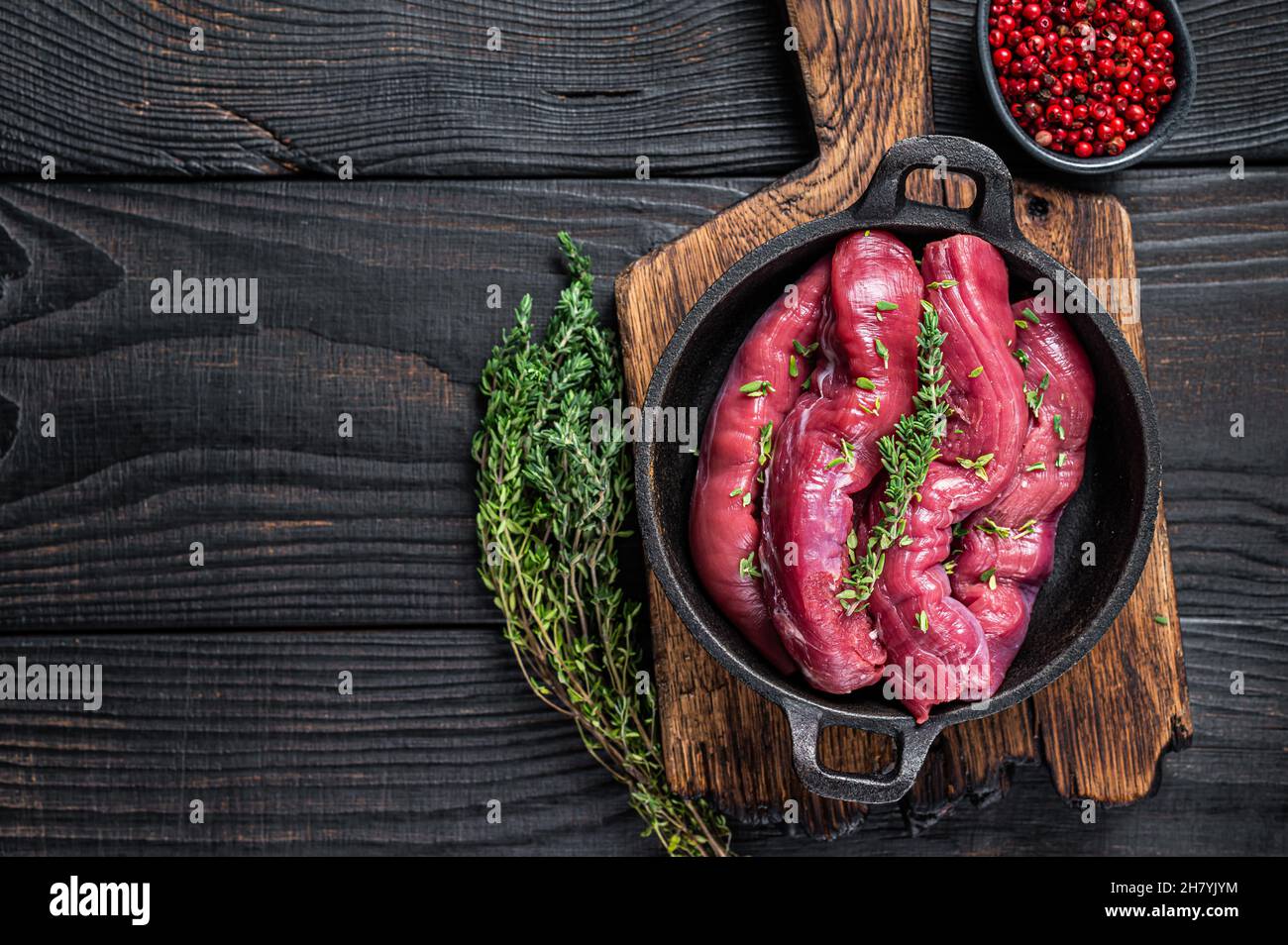 Raw mutton tenderloin Fillet Meat, lamb sirloin in rustic pan with ...