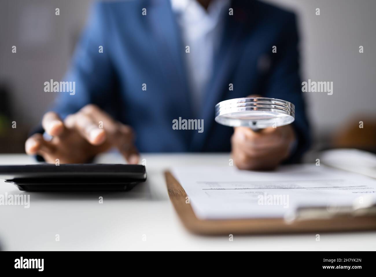 Business Fraud Investigation. Auditor Using Magnifying Glass To ...