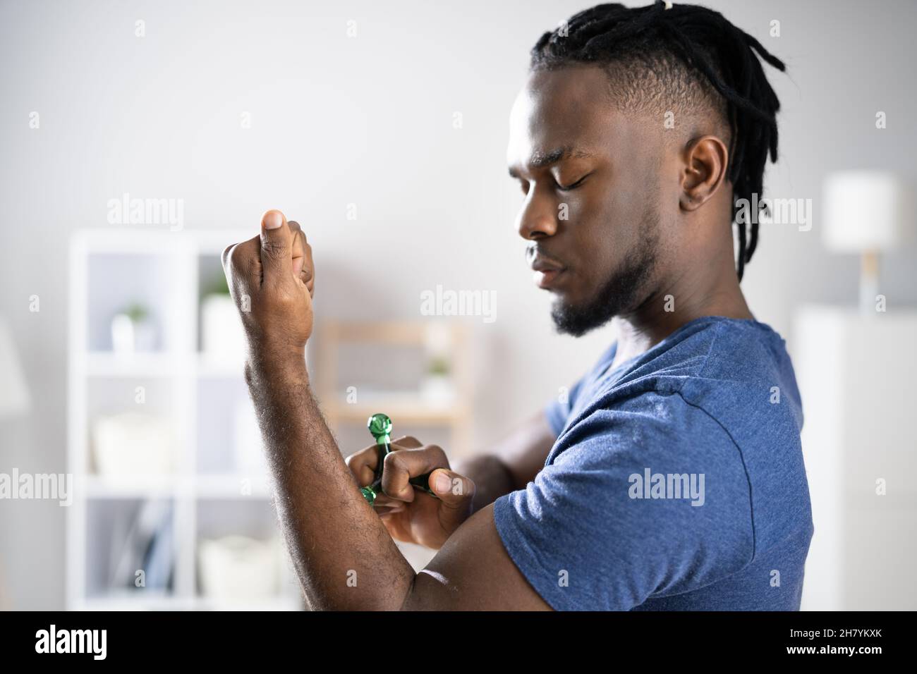 Young african man stretching neck hi-res stock photography and images ...