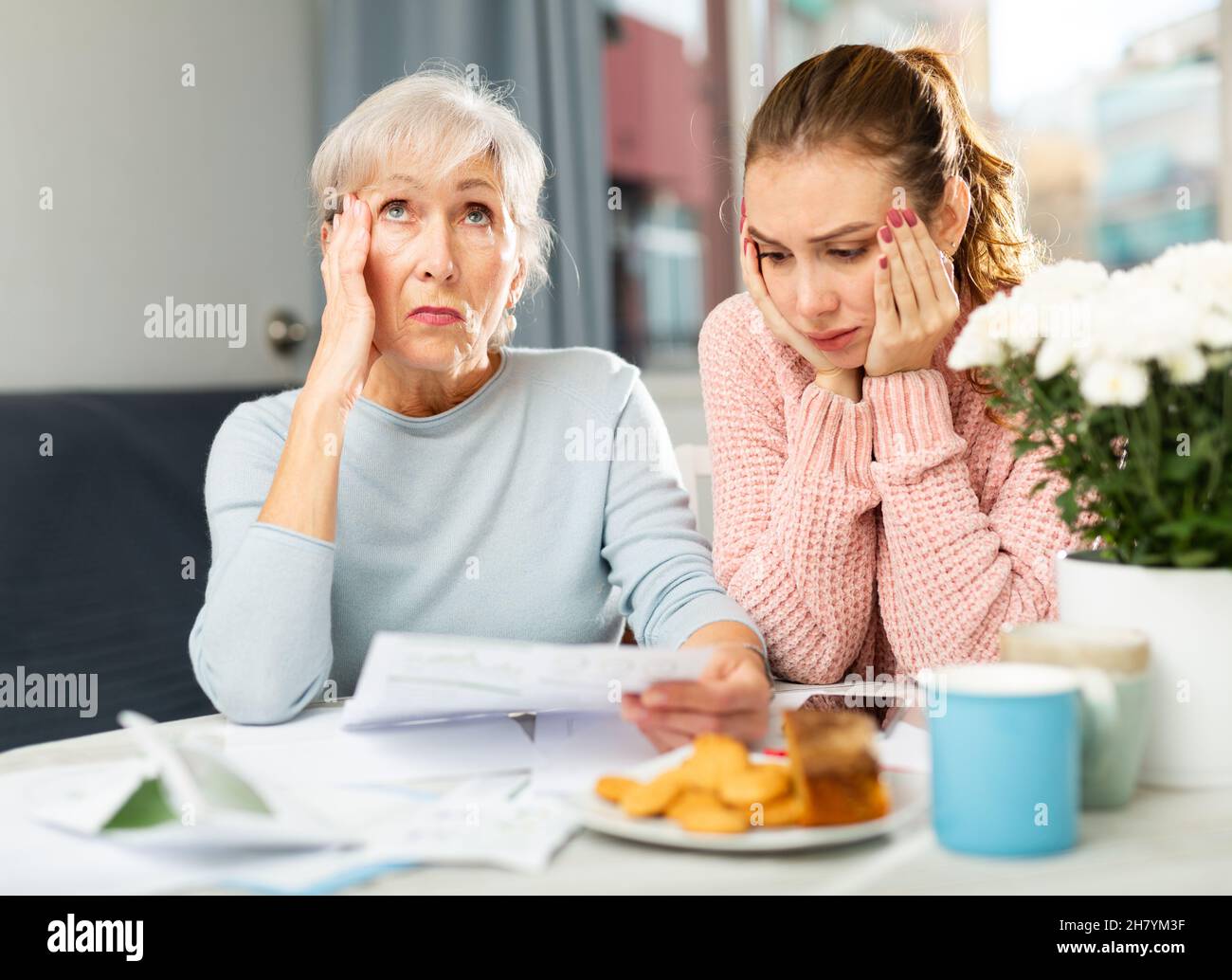 Mother and daughter figuring out finance problem Stock Photo - Alamy