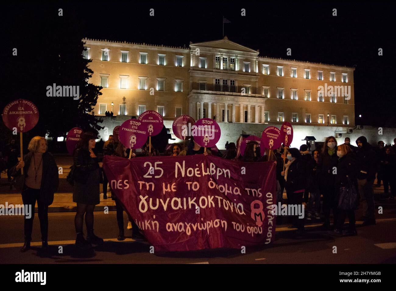 Athens, Greece. 25th Nov, 2021. Protesters hold banners and placards ...