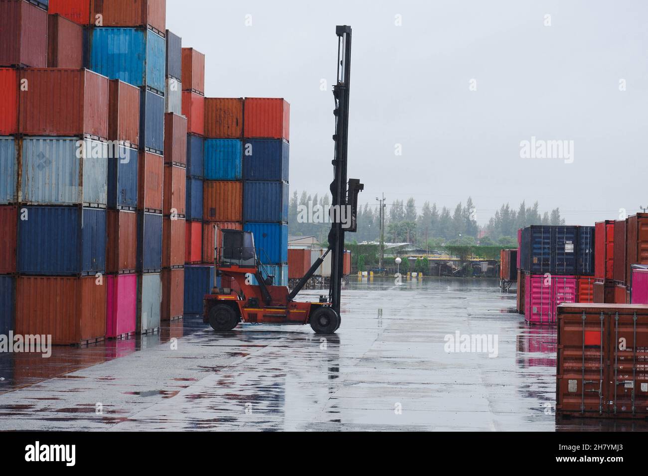 container forklift moving containers working in the rain Stock Photo ...