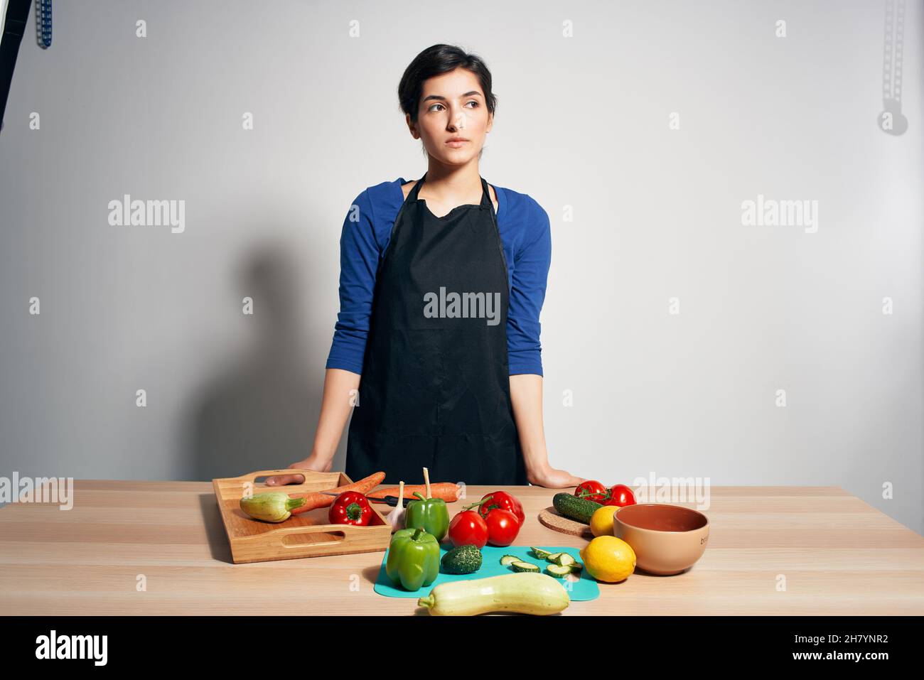 woman in apron cooking at home vegetables healthy eating Stock Photo ...