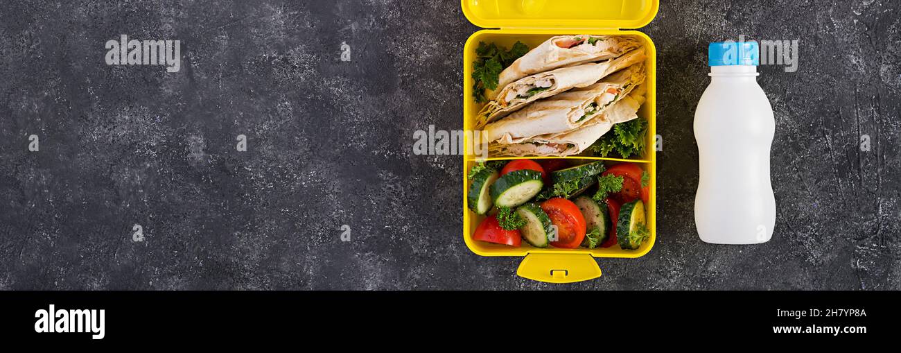 School lunchbox. Healthy lunch box with tortilla wraps stuffed chicken ...