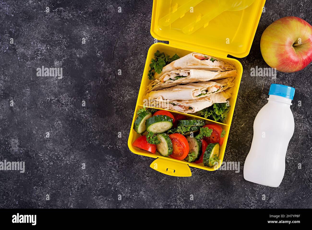 School lunchbox. Healthy lunch box with tortilla wraps stuffed chicken ...