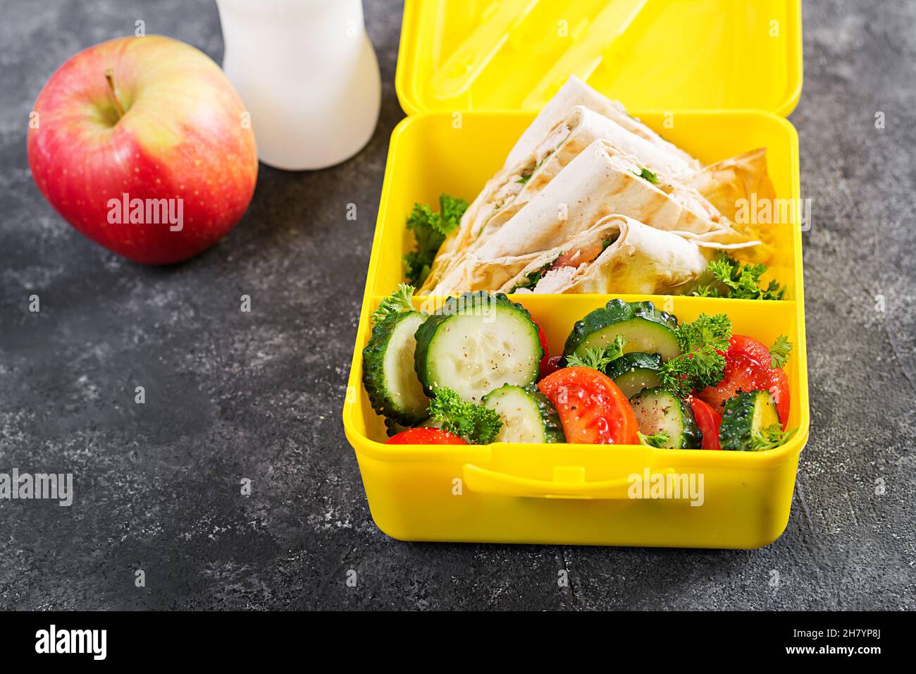 School lunchbox. Healthy lunch box with tortilla wraps stuffed chicken ...
