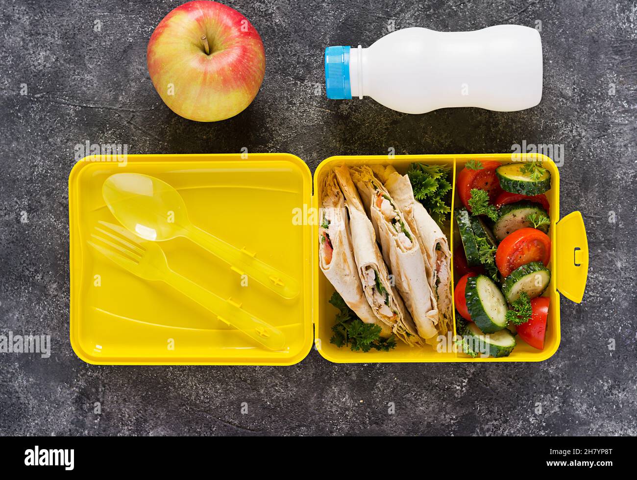 School lunchbox. Healthy lunch box with tortilla wraps stuffed chicken ...