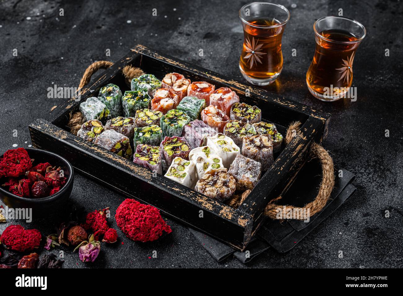 Turkish Delight Lukum, Oriental sweets with nuts and black tea. Black ...