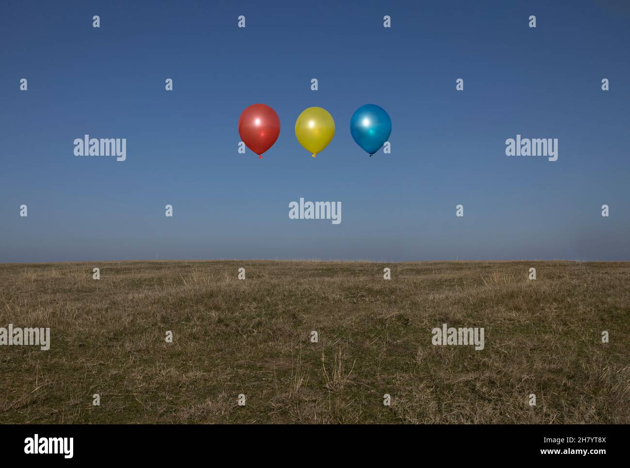 Three balloons flying in the air Stock Photo - Alamy